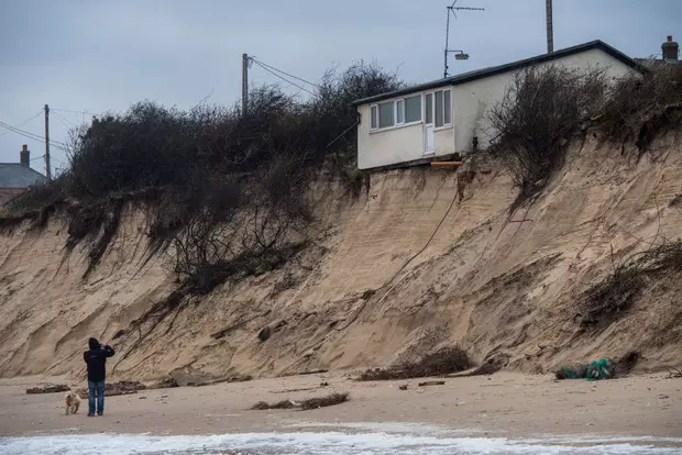 Photo number 1 - houses depended on the break after the shore was shorn in the sea!